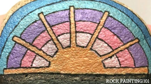 Watch how to paint an amazing graphic sunset - Rock Painting 101