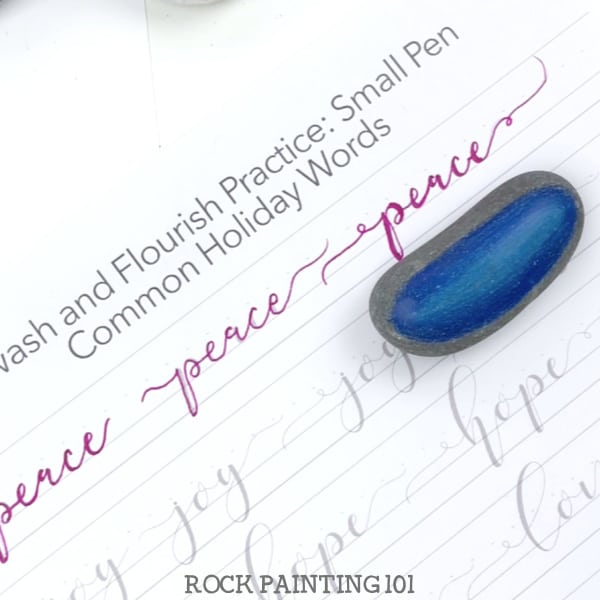 Tips for hand lettering a single word onto a painted rock