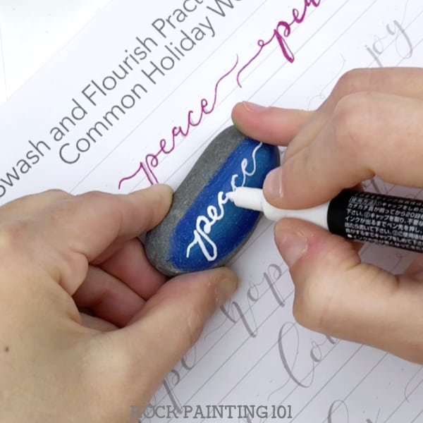 Tips for hand lettering a single word onto a painted rock