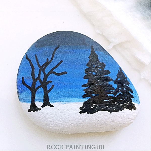 How to make this beautiful winter scene rock painting idea